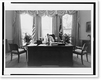 Historic Print, [Bill Clinton, half-length portrait, seated at desk in ...