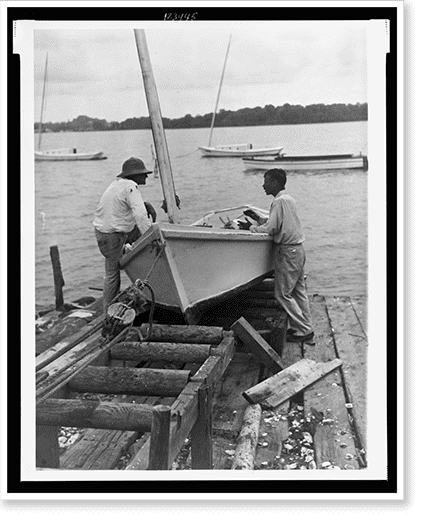 Historic Print, [Capt. Ed Leatherbury with another man and a boat on ...