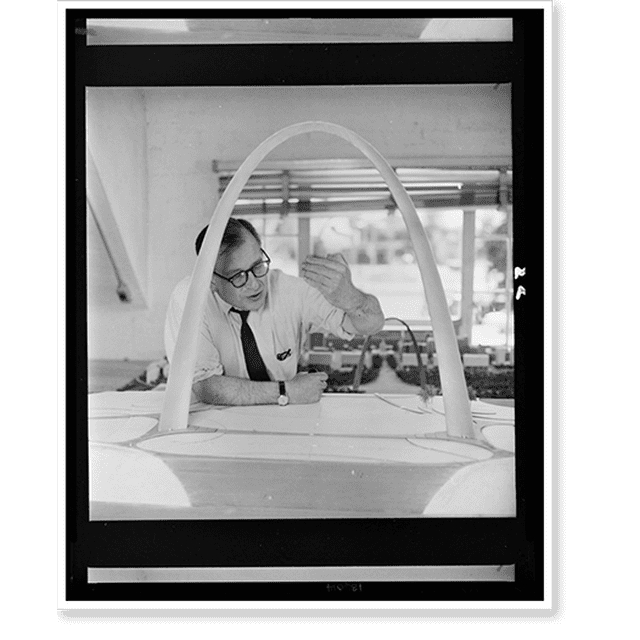 Historic Print, [Eero Saarinen posed by a model of the St. Louis, Mo ...