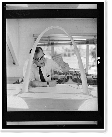 Historic Print, [Eero Saarinen posed by a model of the St. Louis, Mo ...