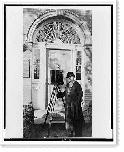 Historic Print, [Frances Benjamin Johnston, full-length portrait, standing in front of door ...
