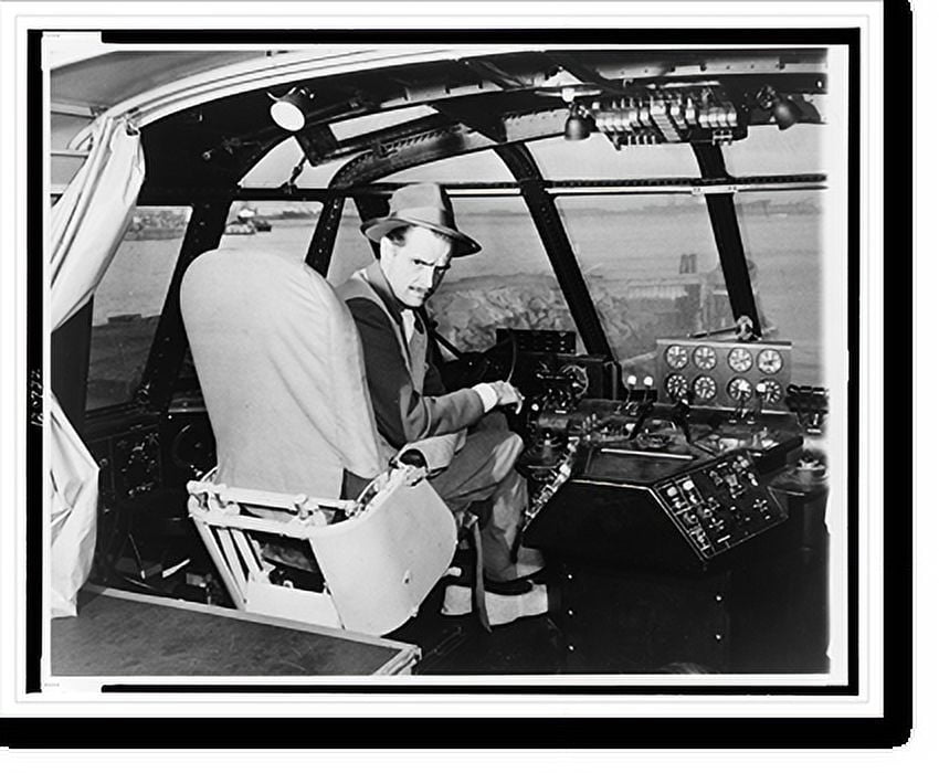 Historic Print, [Howard Hughes, seated in cockpit of wooden flying boat ...