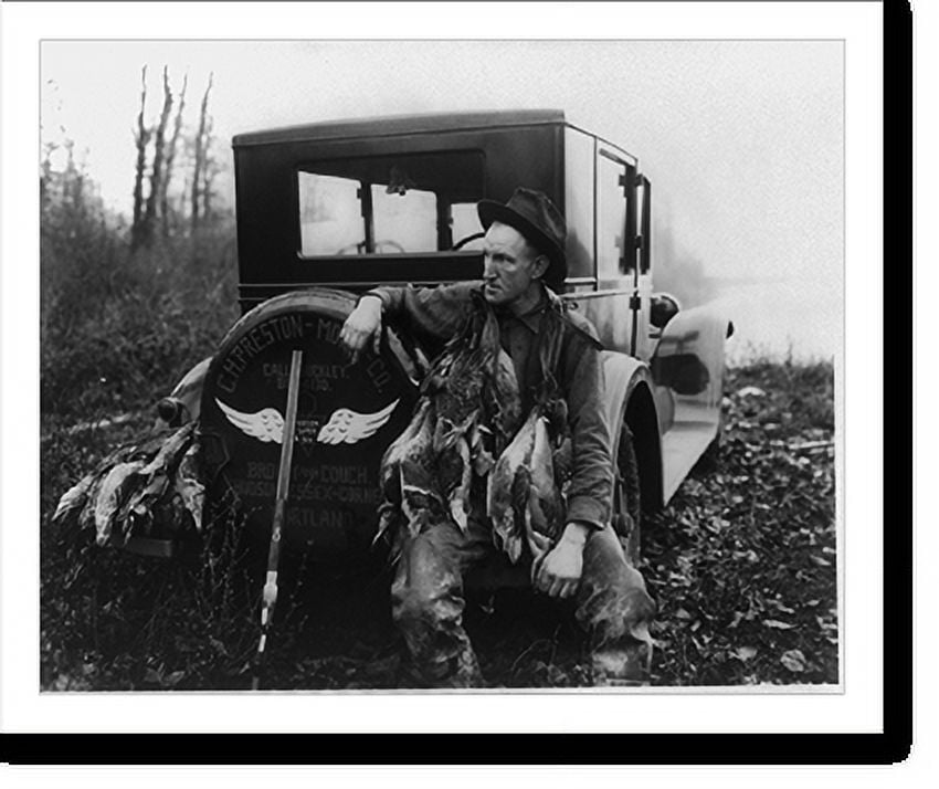 Historic Print, [Hunter with ducks seated on bumper of Hudson ...