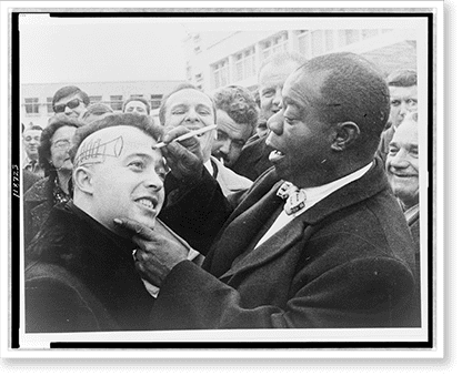 Historic Print, [Louis Armstrong drawing a trumpet and autographing the ...