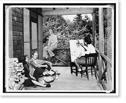 Historic Print, [Nancy Ross seated on porch eating picnic lunch with an ...