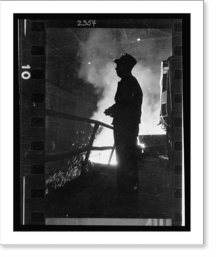 Historic Print, [Steel worker standing in mill with smelter in the ...