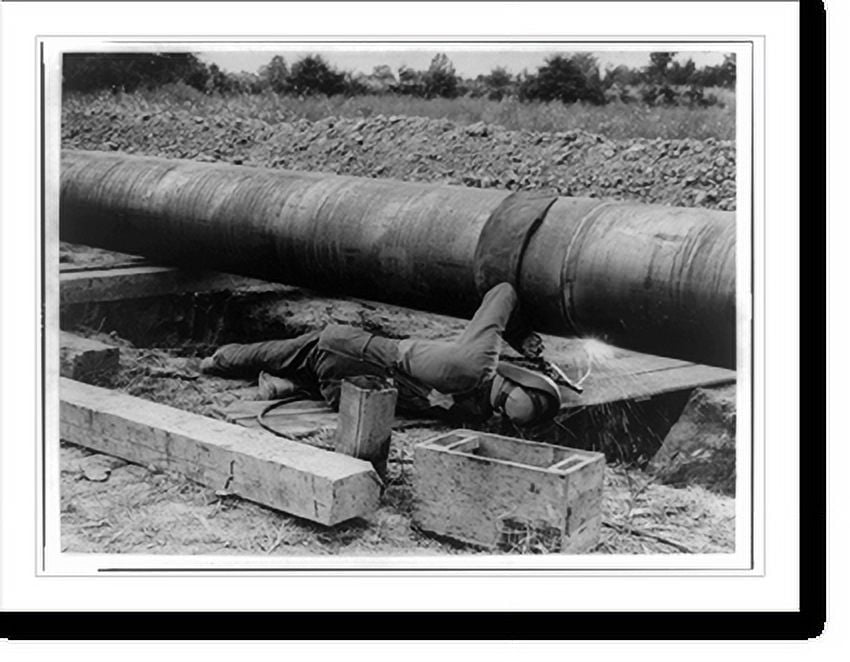 Historic Print, [The Big Inch pipeline under construction: Man welding ...
