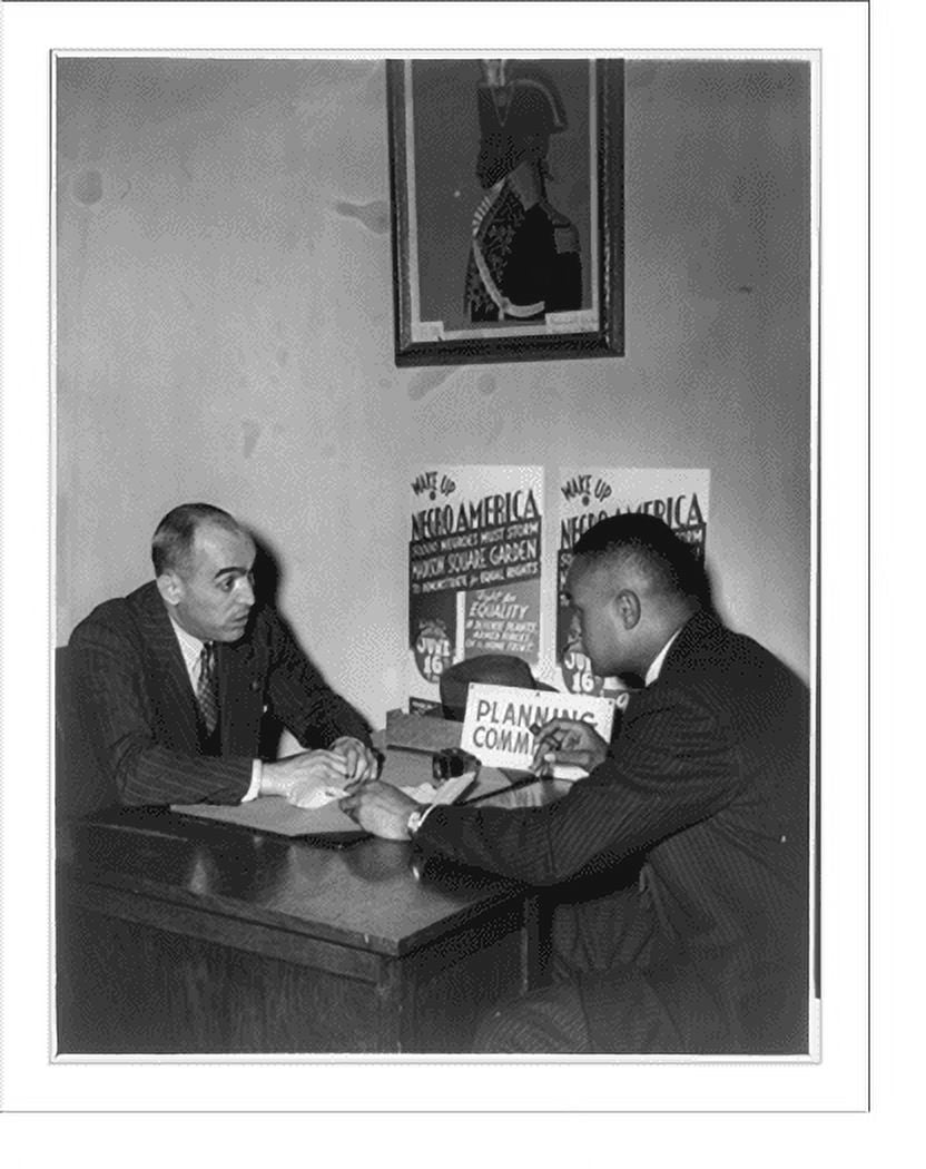 Historic Print, [Two men seated in conversation at desk with posters ...