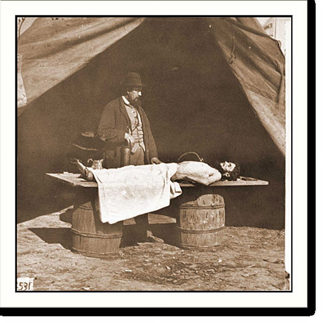 Historic Print, Unknown location. Embalming surgeon at work on soldiers ...