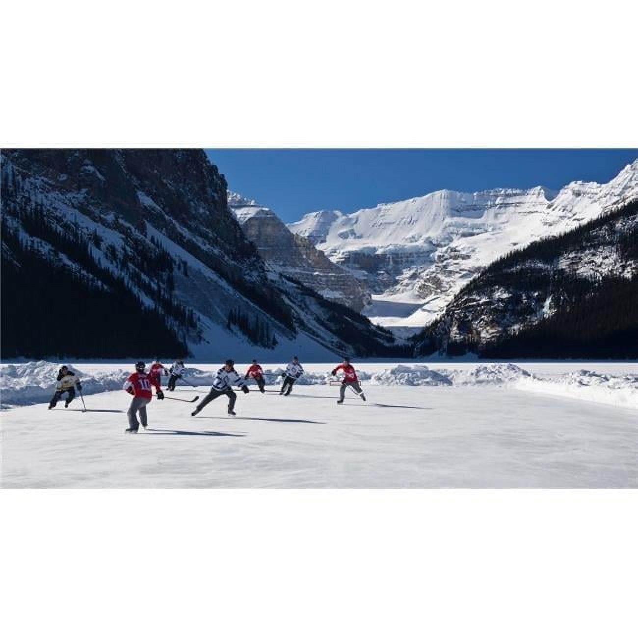 Hockey players playing on the frozen Lake Louise Mount Victoria Banff ...