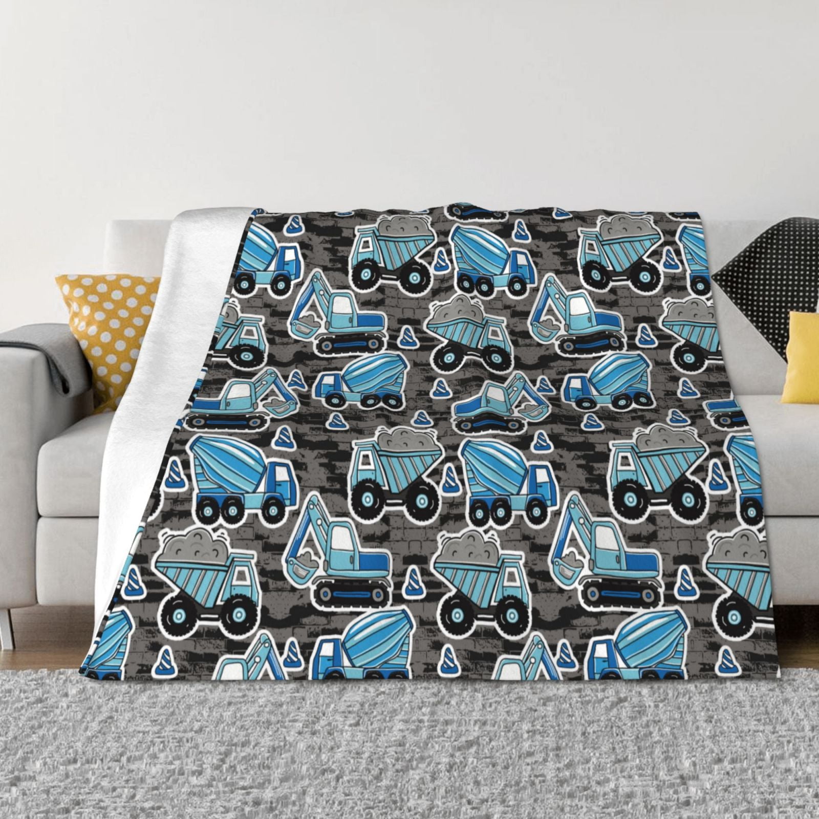 Honeii Blue Excavator print throw blanket, crafted from cozy cotton ...