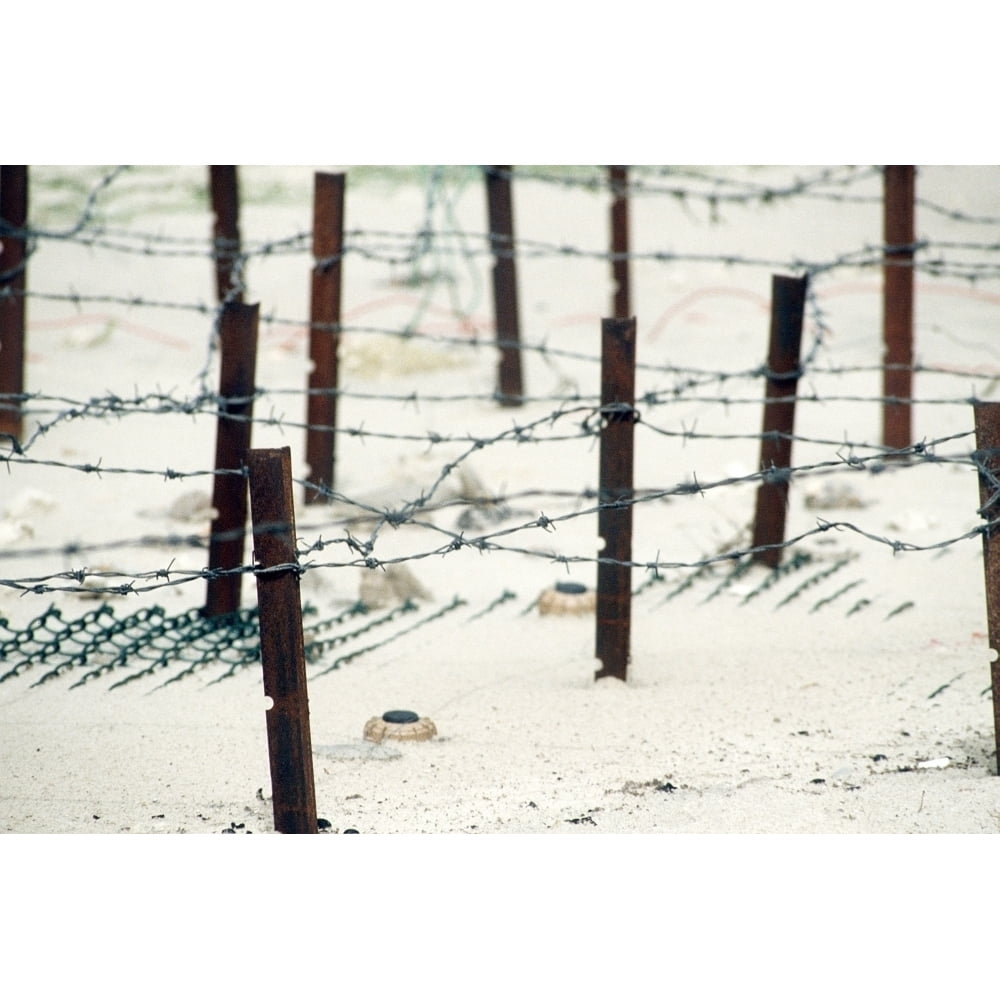 Iraqi Anti-Personnel Mines And Barbed Wire Fences Line A Beach Prior To ...