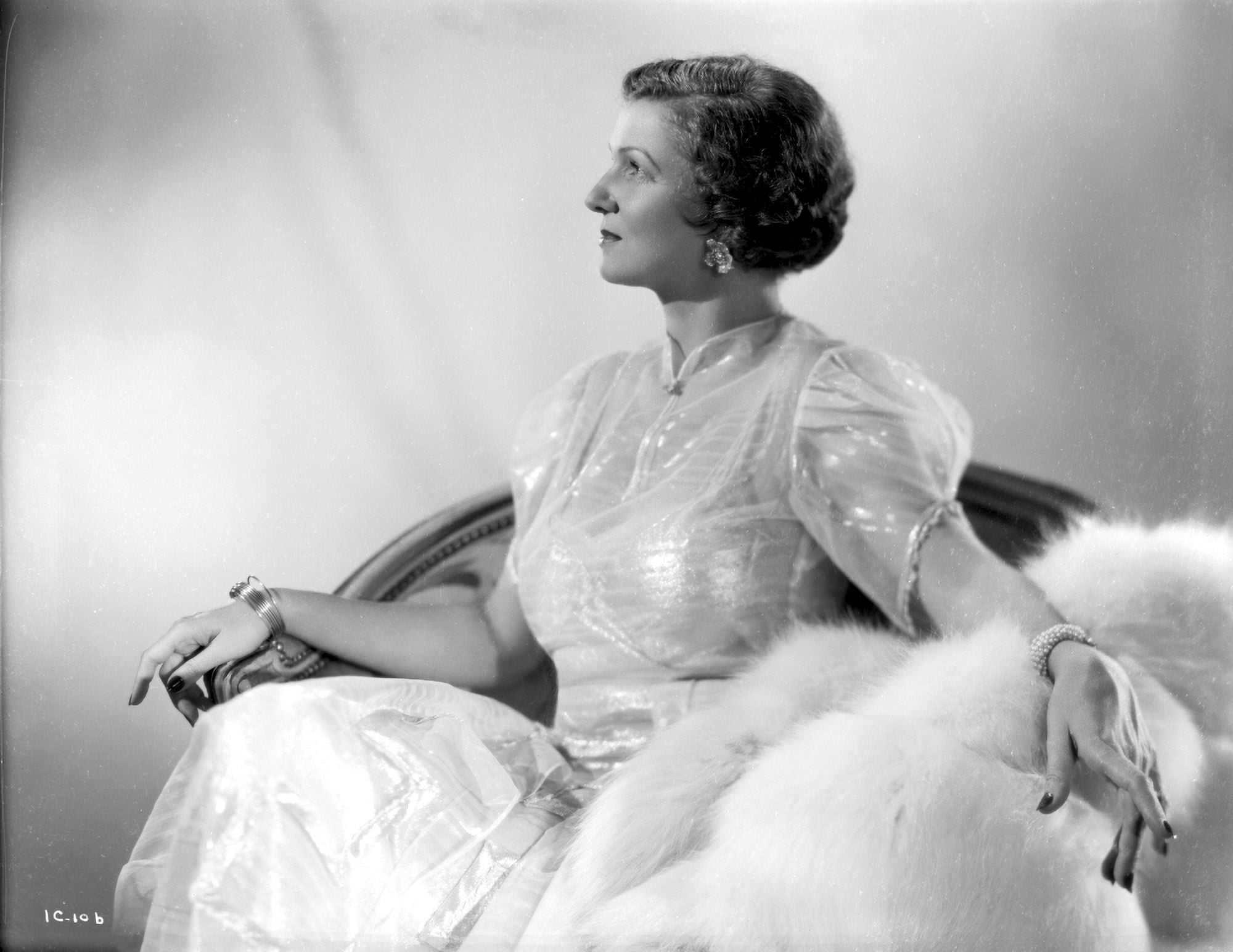 Irene Castle Looking Up on a Chair with Hands on Arm Rest Photo Print ...