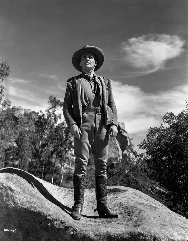 James Cagney standing with Hands on the Side in Cowboy Outfit and ...