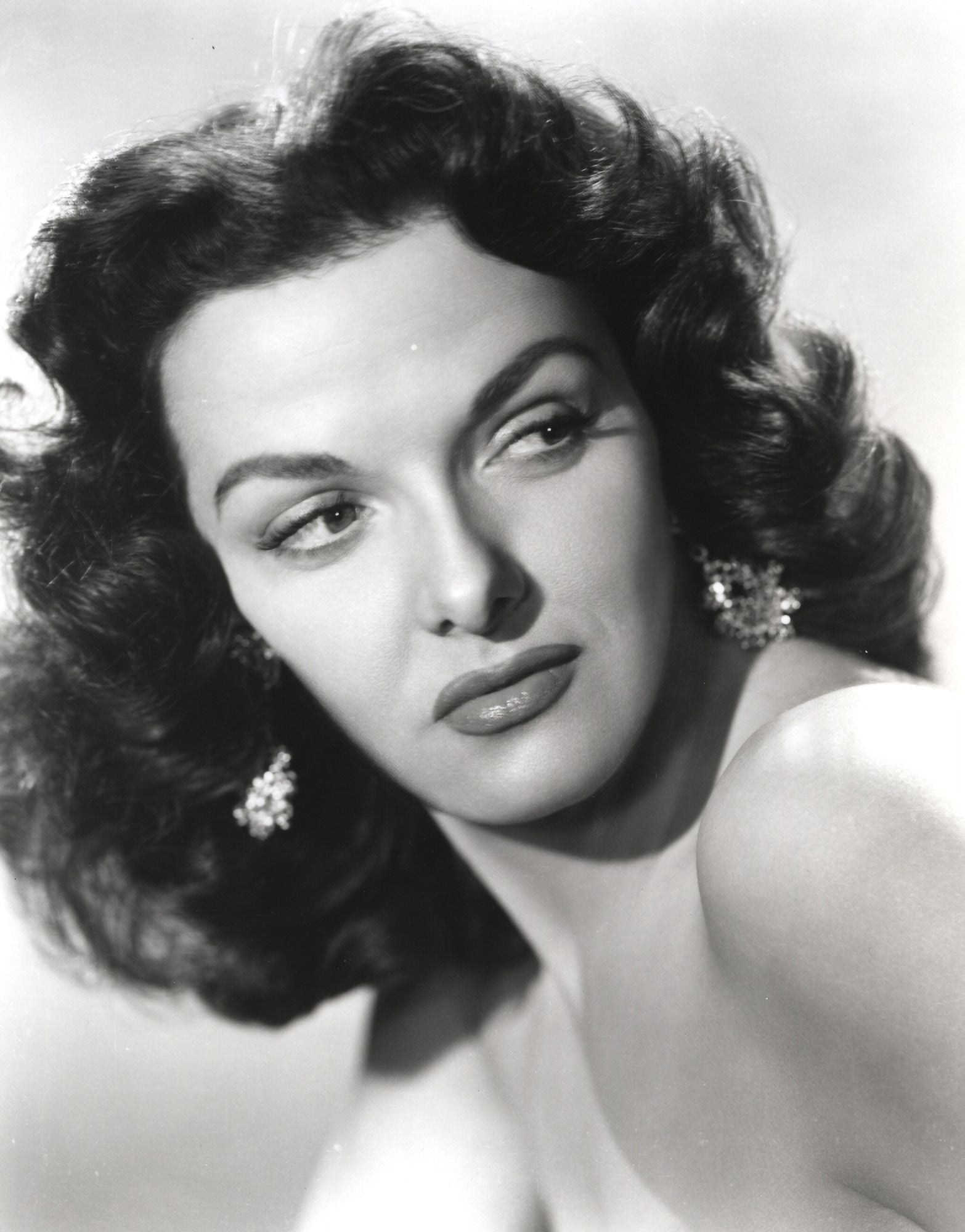 Jane Russell Portrait in White One Shoulder Dress and Dangling Earrings ...