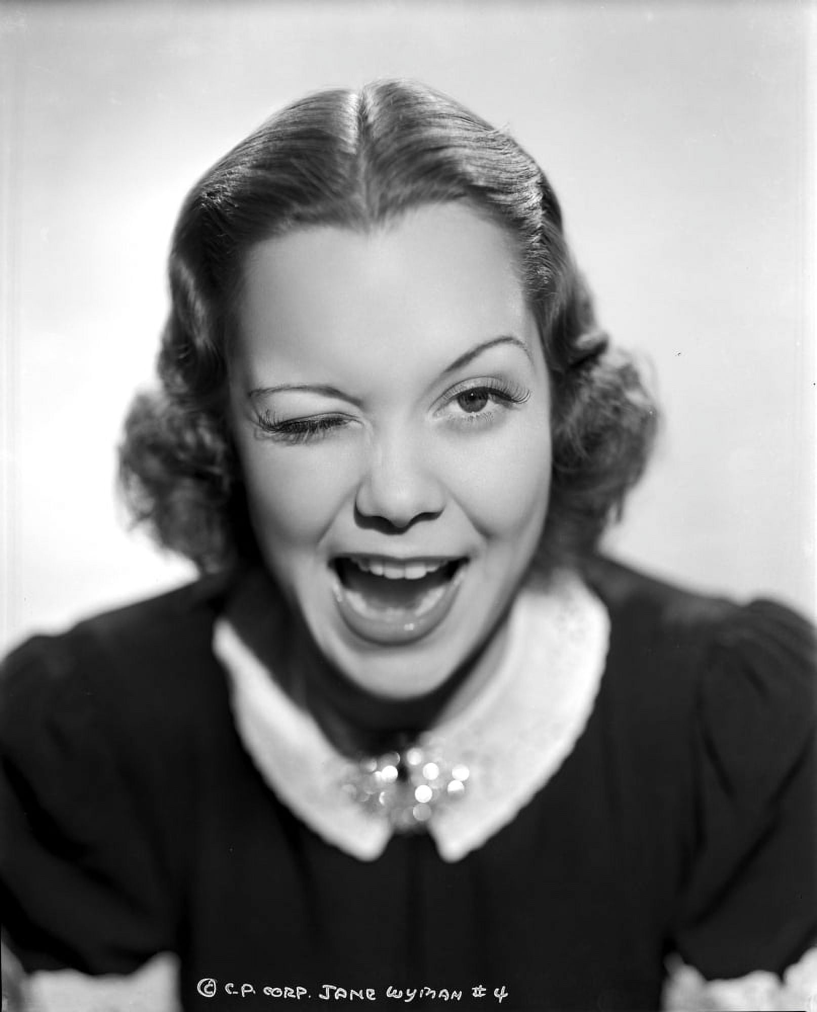 Jane Wyman Portrait in Black Velvet Short Sleeve Dress and White Collar ...