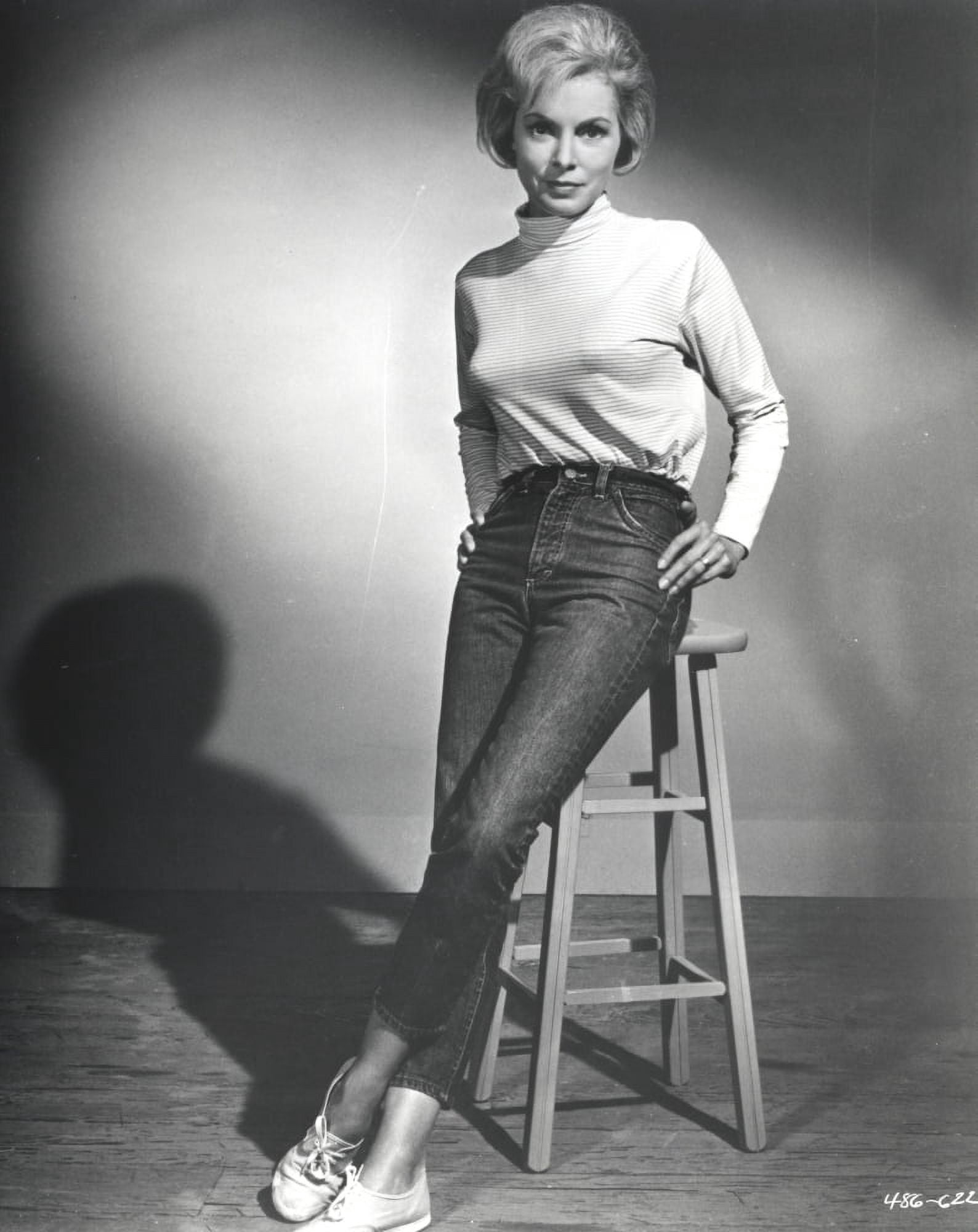 Janet Leigh sitting on the Chair in White High Neck Long Sleeve Linen ...