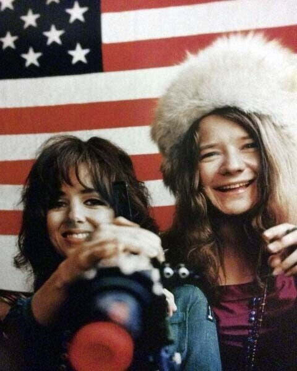 Janis Joplin & Grace Slick circa 1967 smile in front of American flag ...
