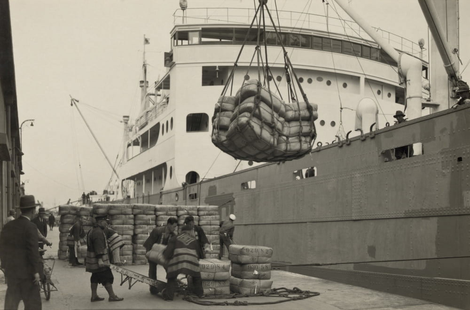 Japanese Longshoremen Loading Bundles Of Raw Silk Onto A Freighter. Ca ...