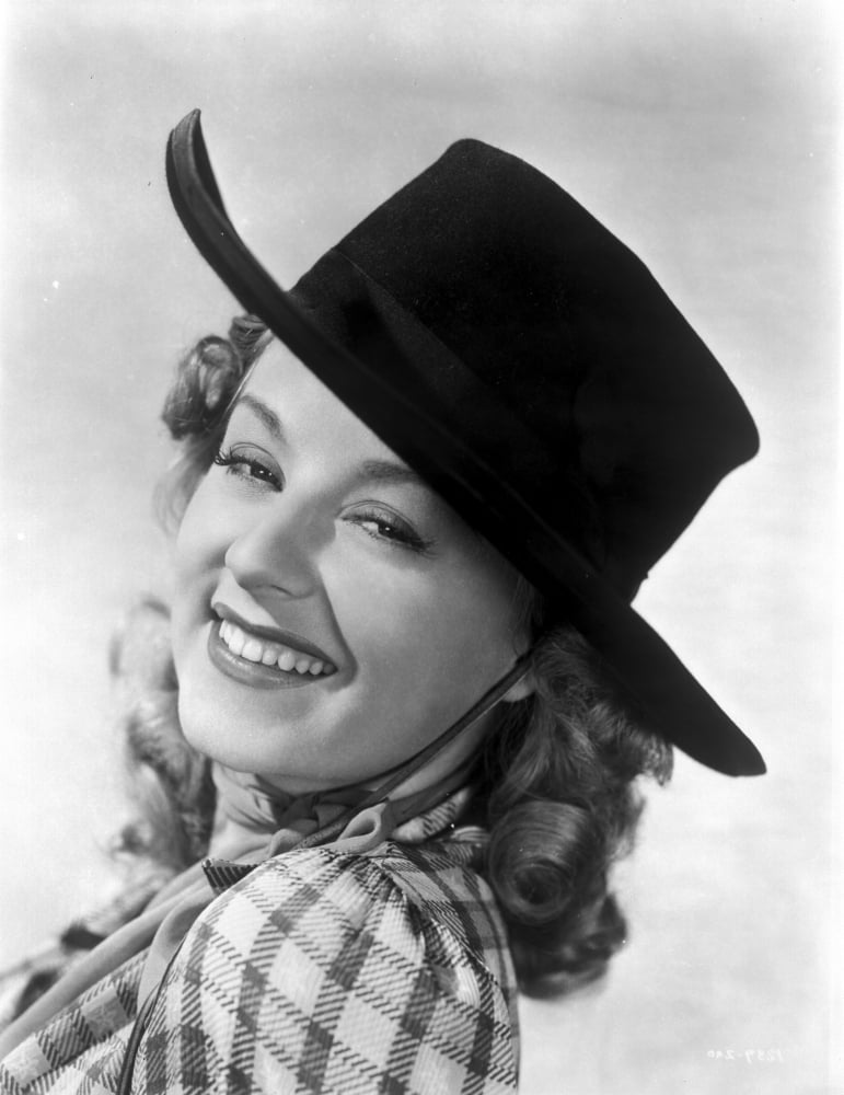 Jennifer Holt on a Checkered Top and Hat on Heat smiling Portrait Photo ...
