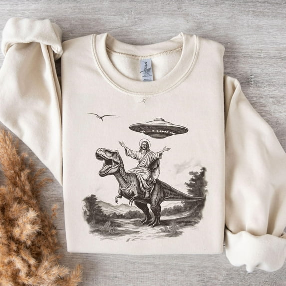 Jesus Dinosaur UFO Sweat, Funny Alien Meme Tee, Riding T Rex Graphic Sweat, Absurd Religious ...