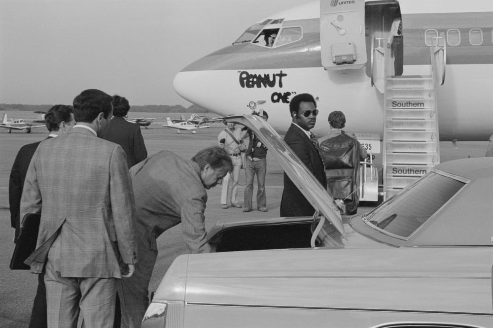 Jimmy Carter Retrieving His Luggage From A Car Before Boarding 'Peanut ...