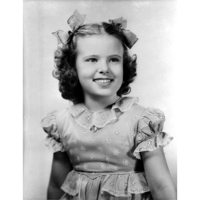 Joan Carroll wearing a Dress and a Pair of Hair Bow in a Classic ...