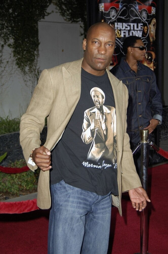 John Singleton (Wearing A Marvin Gaye T-Shirt) At Arrivals For Hustle ...