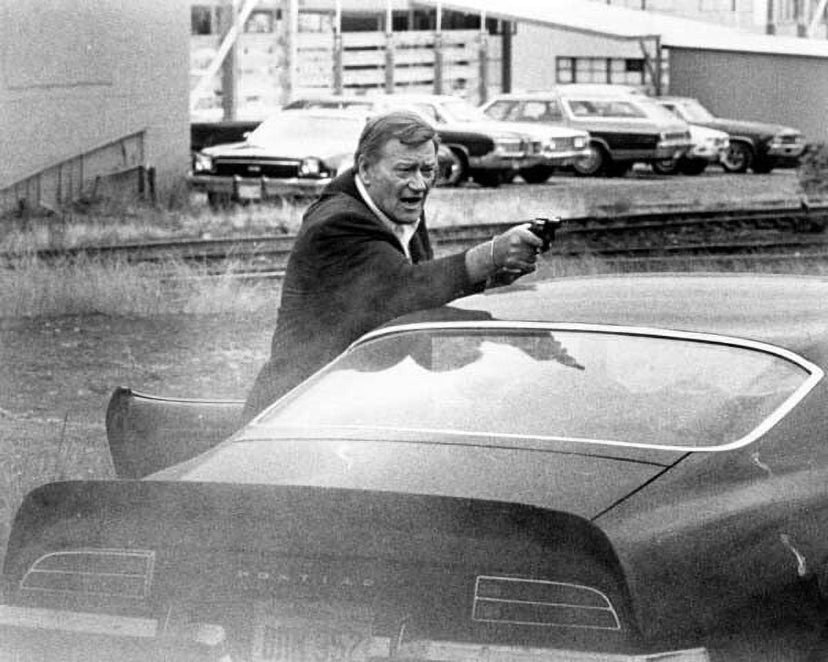 John Wayne takes aim with gun over his Pontiac Grand-Am 1974 McQ 8x10 photo - Walmart.com