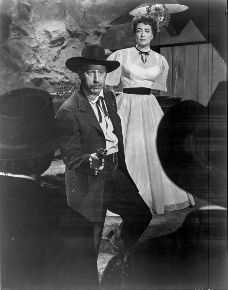 Johnny Guitar Man Pointing a Gun in Black Suit with Woman in White ...