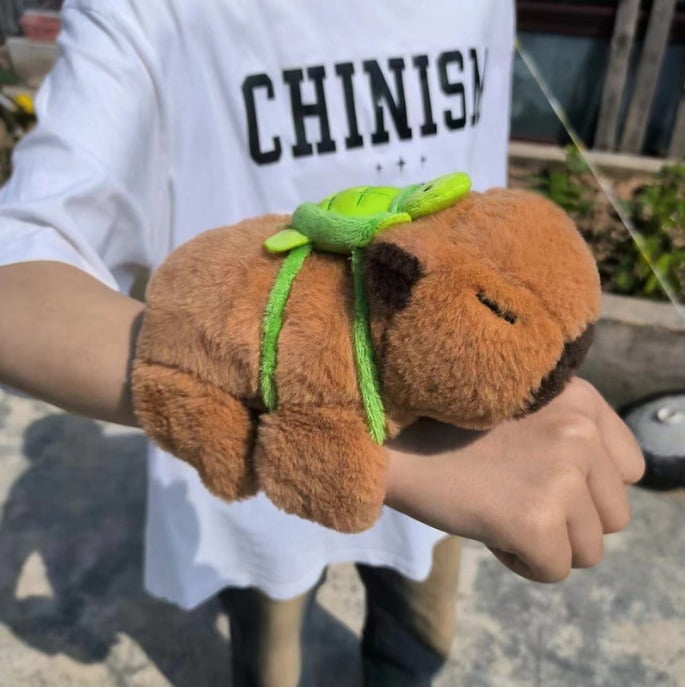 Kapibara Plush Doll Lying on The Hands of Kapi Bara Water Dolphin Doll ...