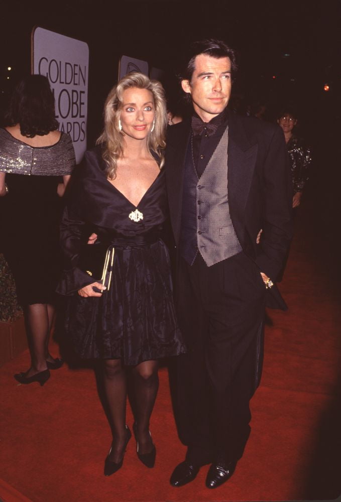 Katherine Kinley In All Black & Pierce Brosnan In Black Suit And Gray ...