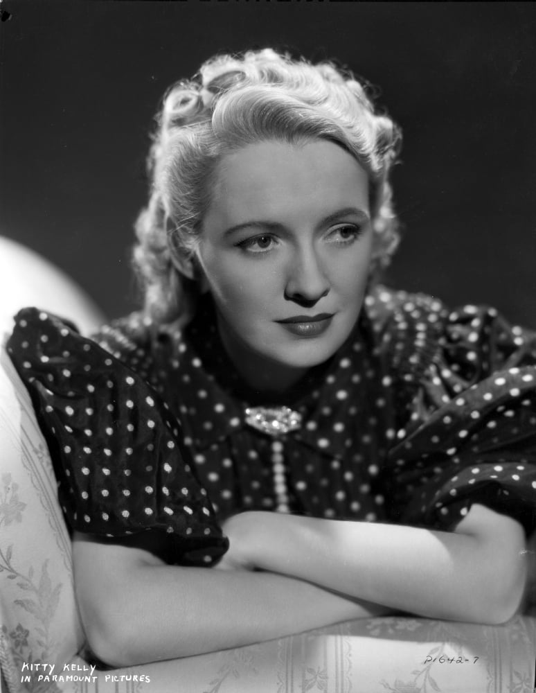 Kitty Kelly on Polka Dotted and Puffed Sleeve Leaning Portrait Photo ...