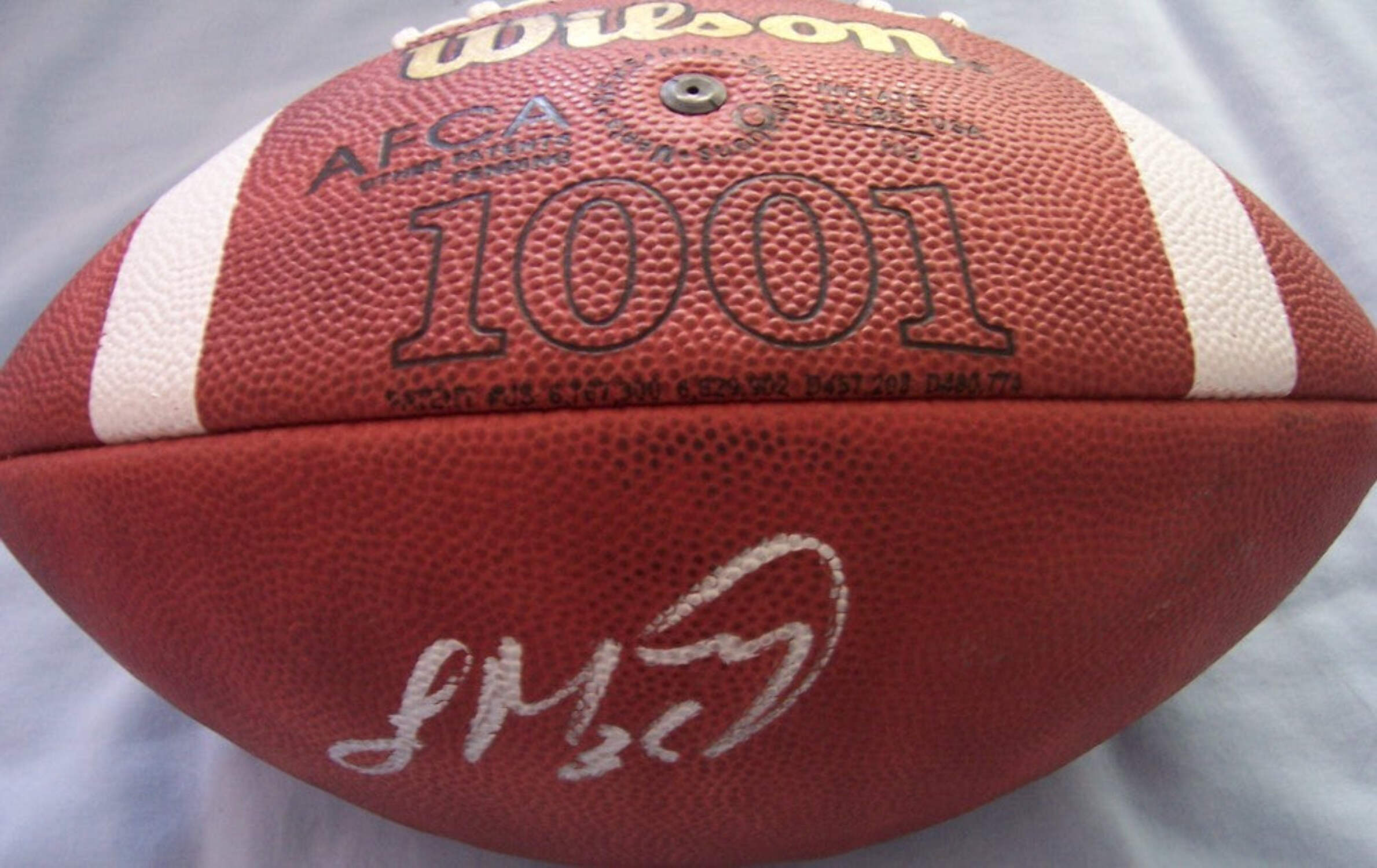 Laurence Maroney autographed Wilson NCAA leather football (JSA ...