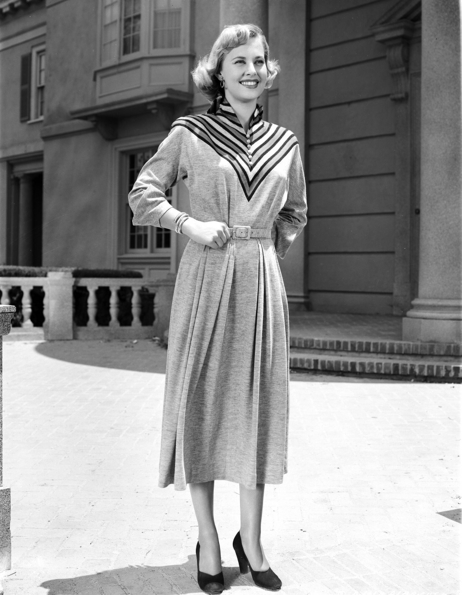 Lola Albright smiling in a Dress and Black Shoes, and Hands on Waist ...