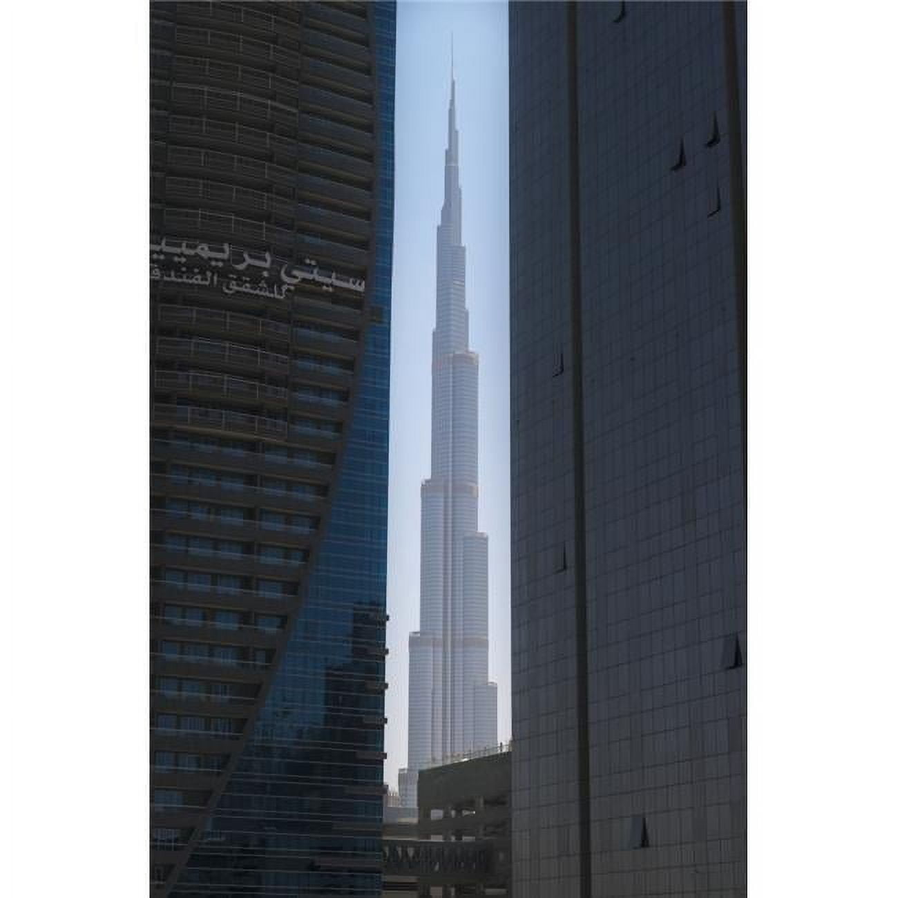 Looking between two tall office buildings to the Burj Khalifa; Dubai ...