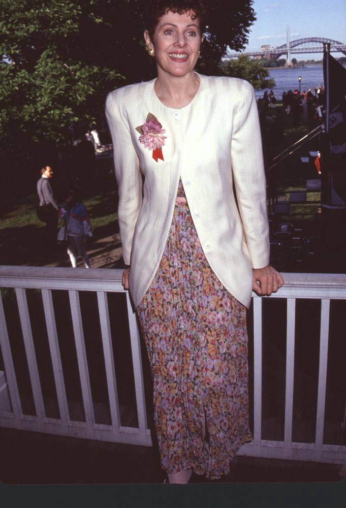 Lynn Redgrave In Floral Skirt And White Blazer Leaning On Handrail ...