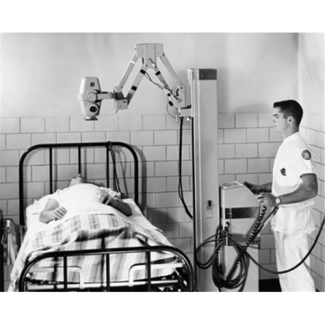 Male Radiologist Taking an X-Ray of a Patient Poster Print - 18 x 24 in ...