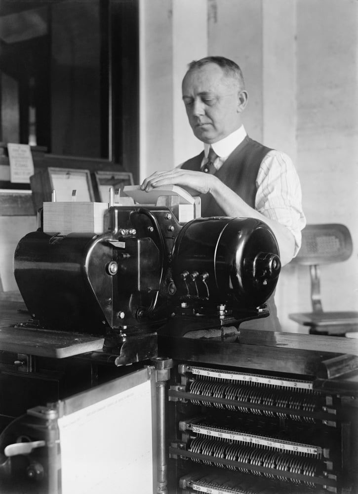 Man Loading Punch Cards Into A Tabulating Machine Used In The 1920 ...