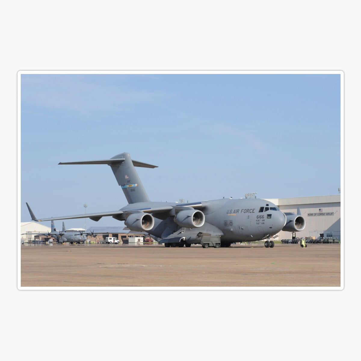 Maneki A C-17 Globemaster Iii Parked On The Ramp At An Air Force Base ...