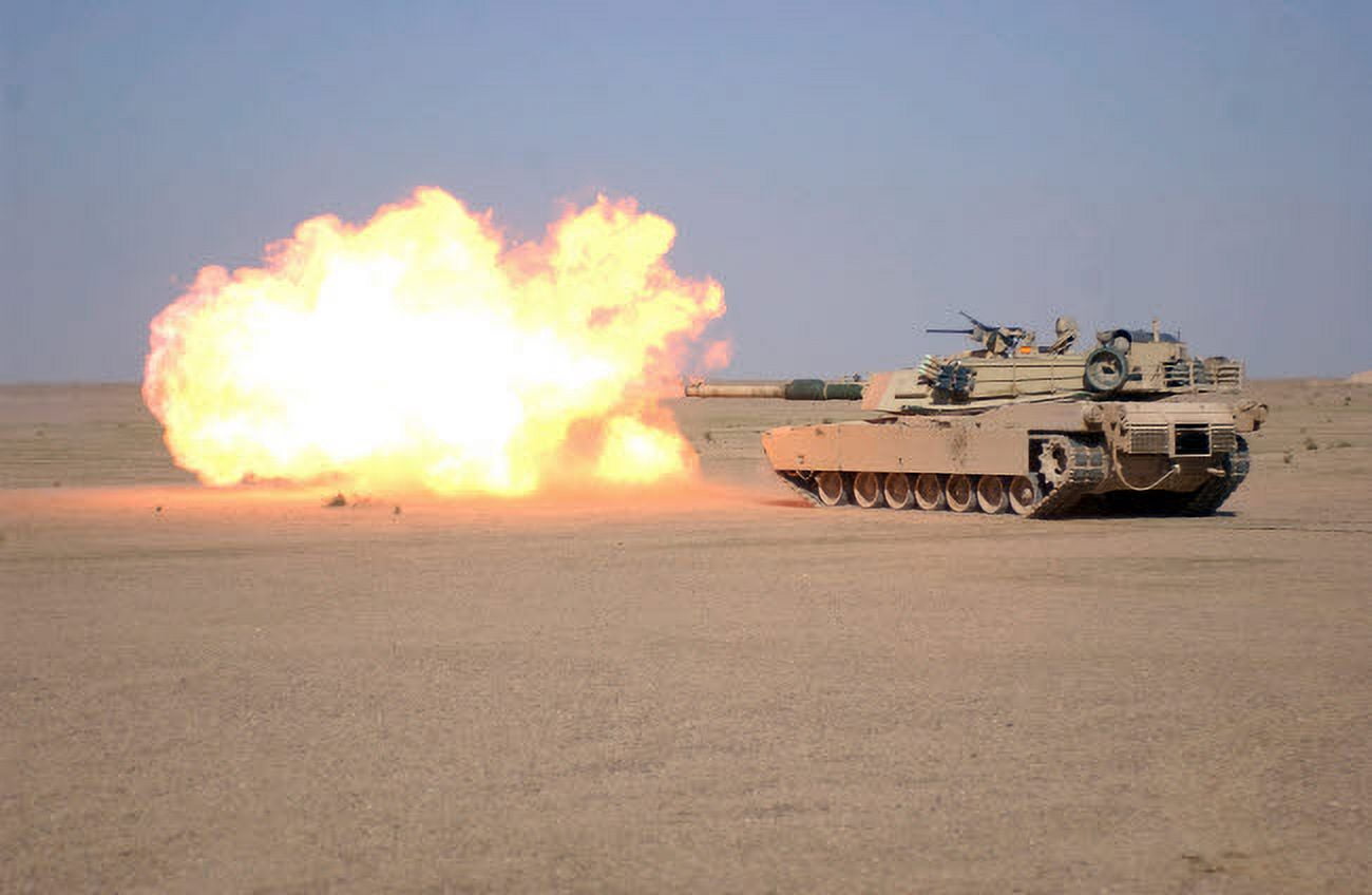 Marines fire their M1A1 Abrams tank main gun in the Iraqi desert Poster ...