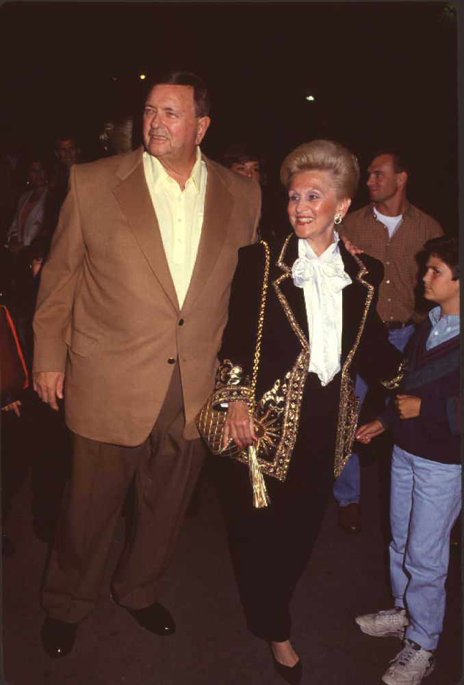 Marvin Davis In Brown Suit With Barbara Davis In Black Suit With Gold ...