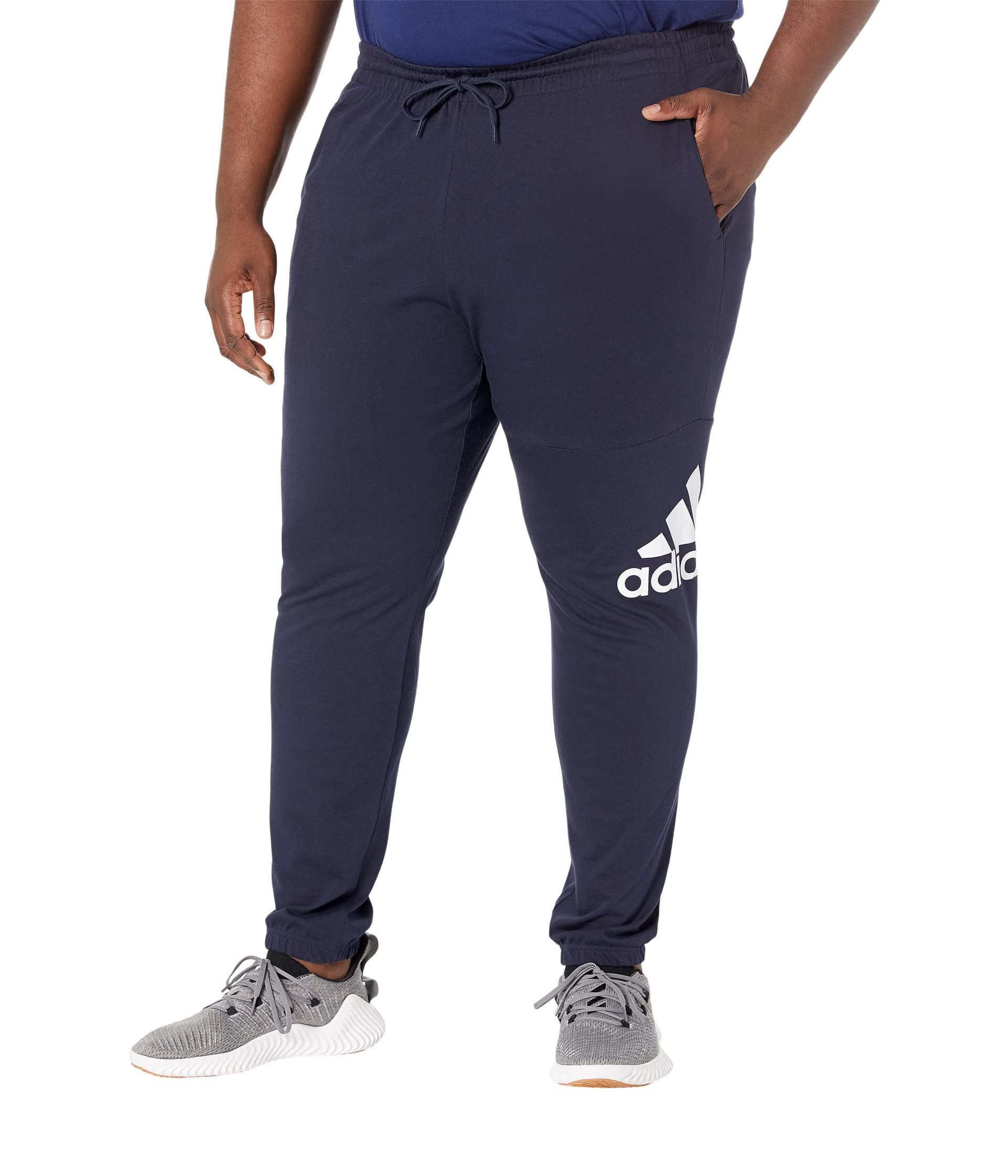 Men's adidas Essentials Badge of Sport Jersey Tapered Pants Color ...