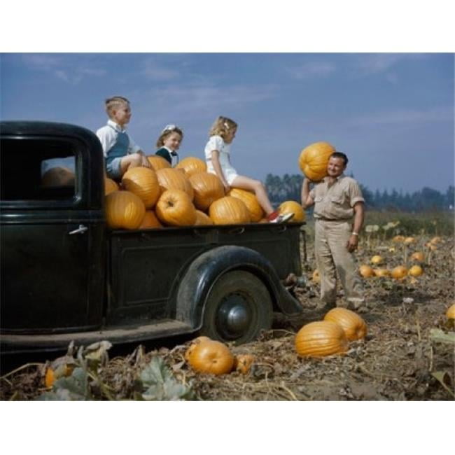 Mid Adult Man Carrying a Pumpkin on His Shoulder with His Three ...