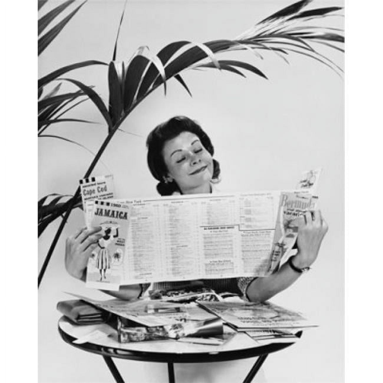 Mid Adult Woman Reading a Brochure & Making a Face Poster Print ...