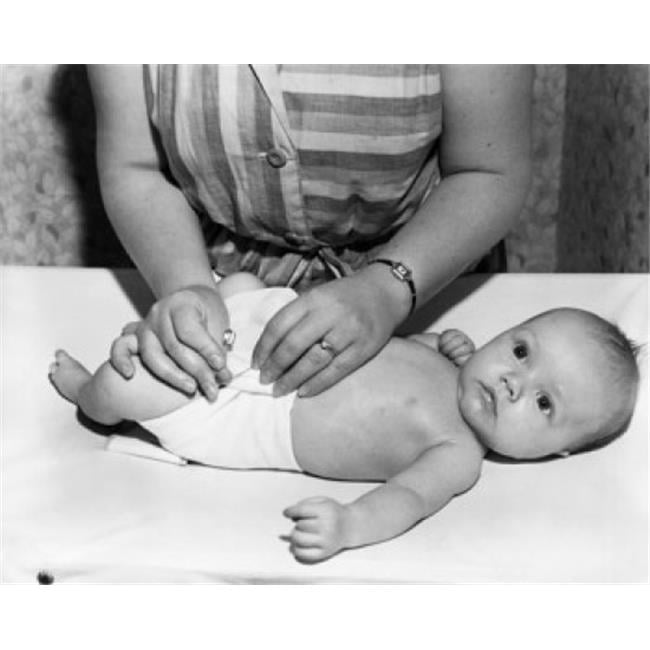 Mid Section View of a Woman Changing Her Babys Diaper Poster Print - 18 ...