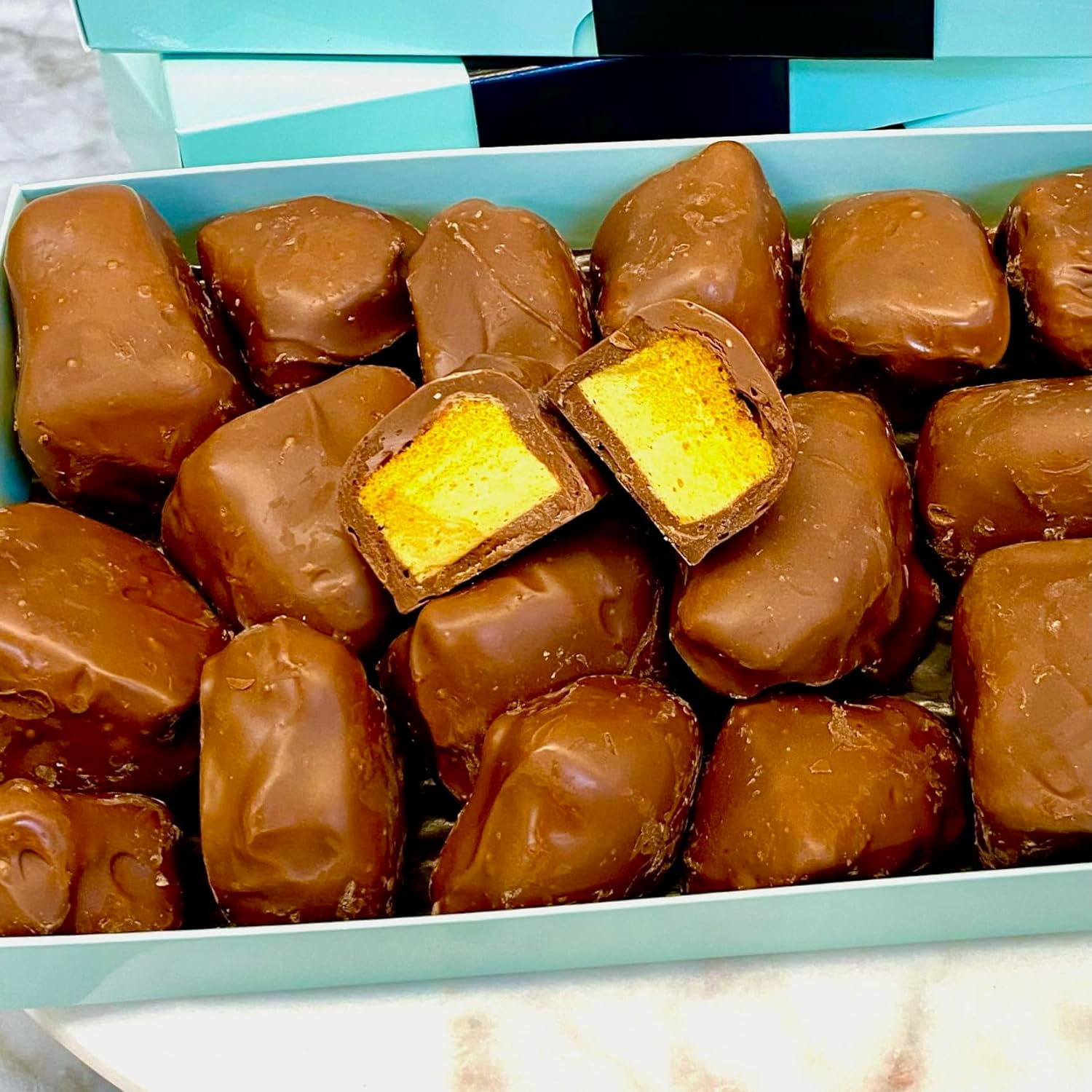 Milk chocolate sponge candy. Crunchie chunks of candy hand dipped In ...