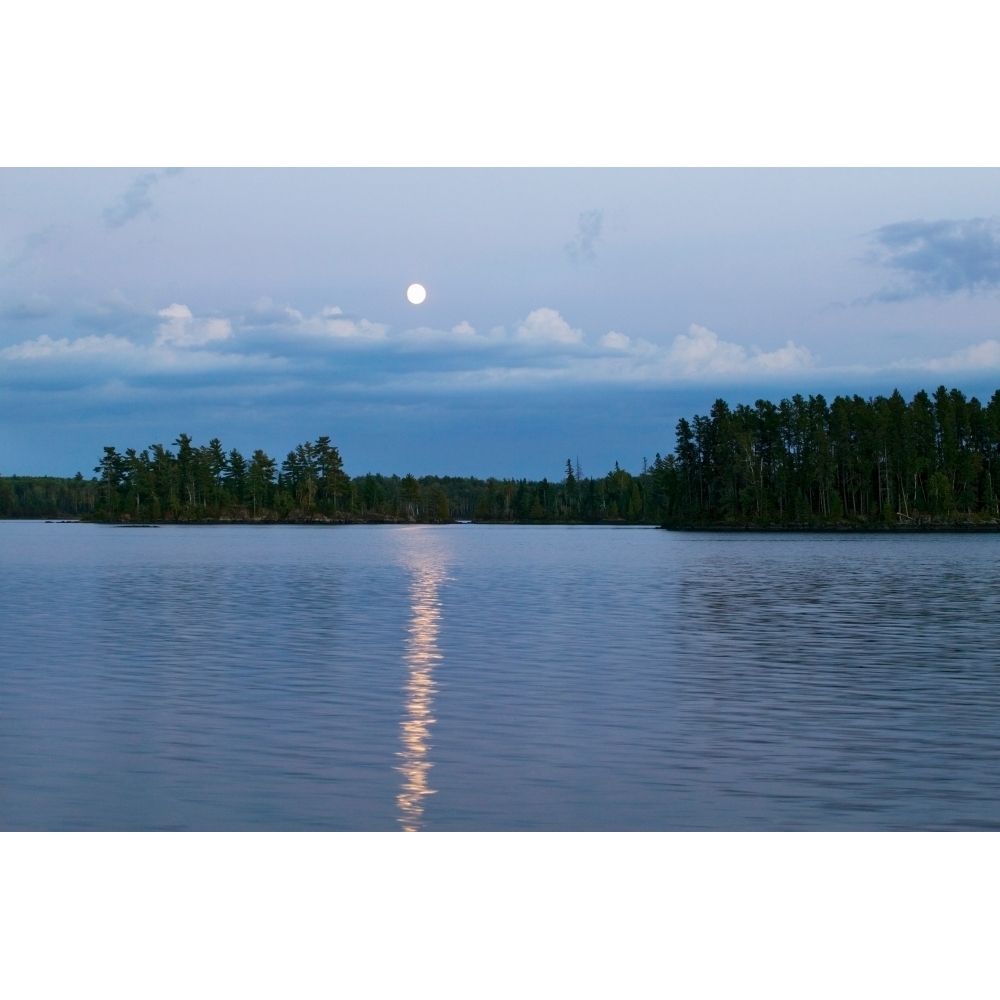 Moon rising over Lake One water reflection Boundary Waters Canoe Area ...
