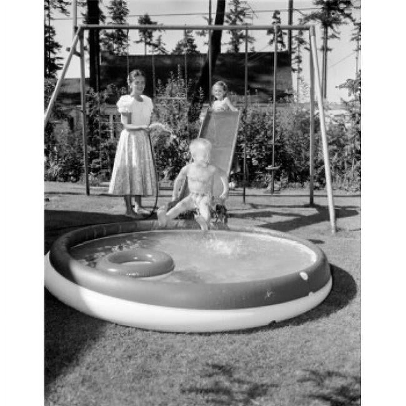 Mother with Two Children Who Sliding Into Wading Pool Poster Print - 18 ...