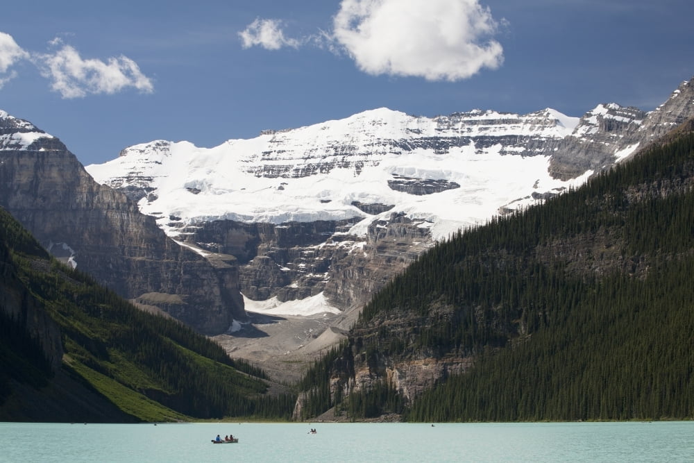 Mount Victoria And Lake Louise With Canoes In The Distance And Blue Sky ...
